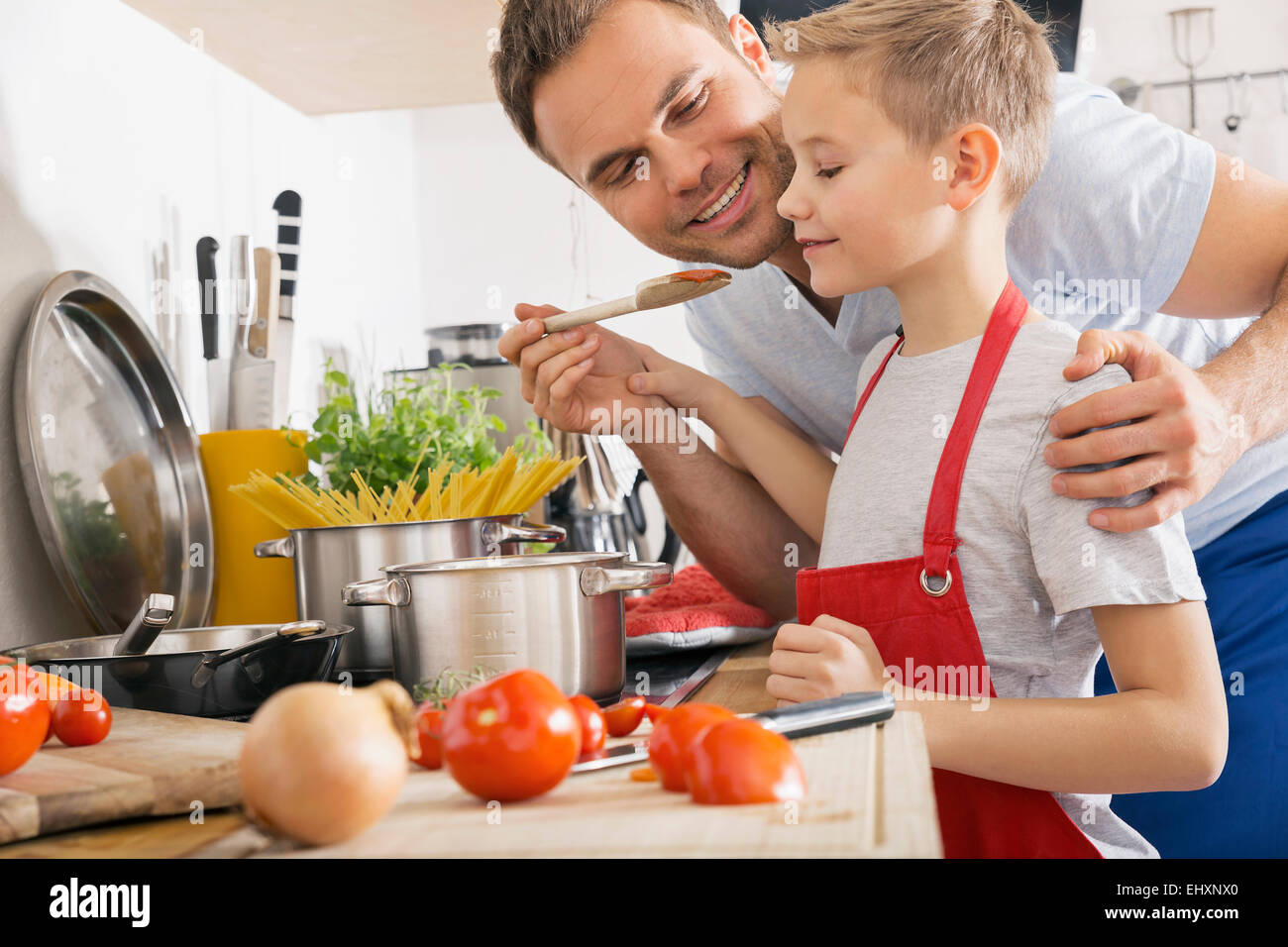 Father and son cooking together Stock Photo - Alamy