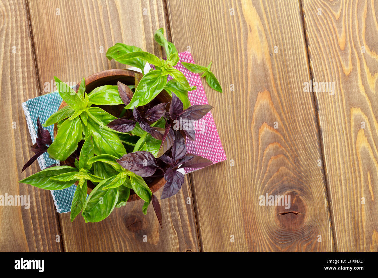 Fresh farmers basil on wood table with copy space Stock Photo - Alamy