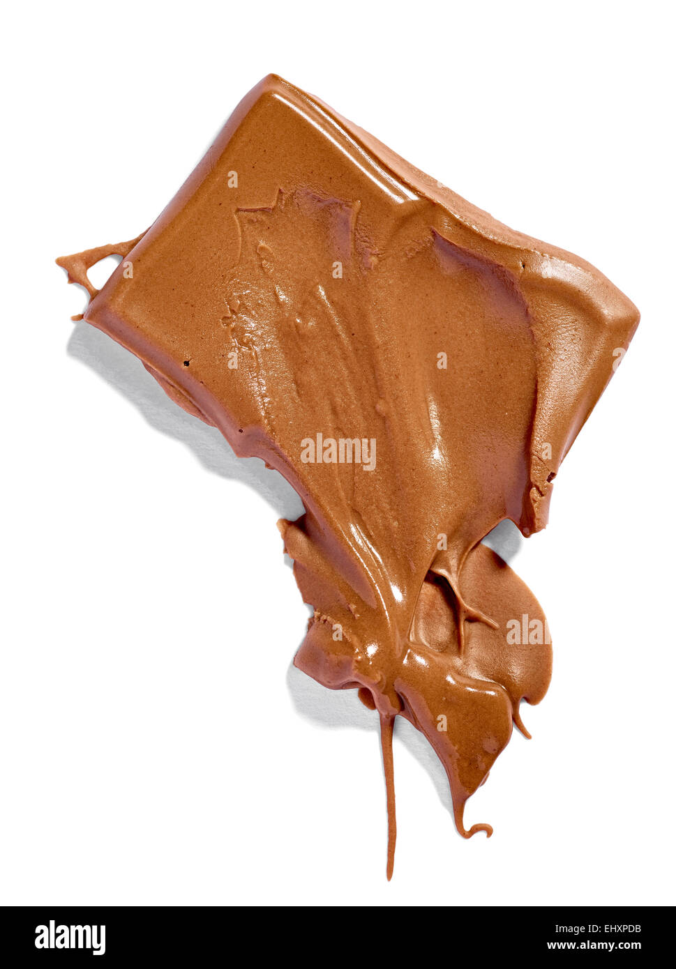 Melted chocolate bar on white background Stock Photo - Alamy