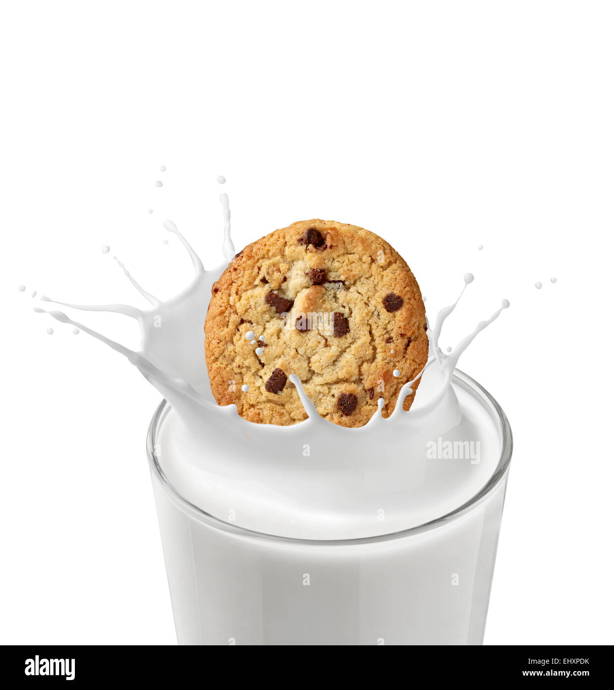 Chocolate cookie falling in glass of milk in front of white background ...