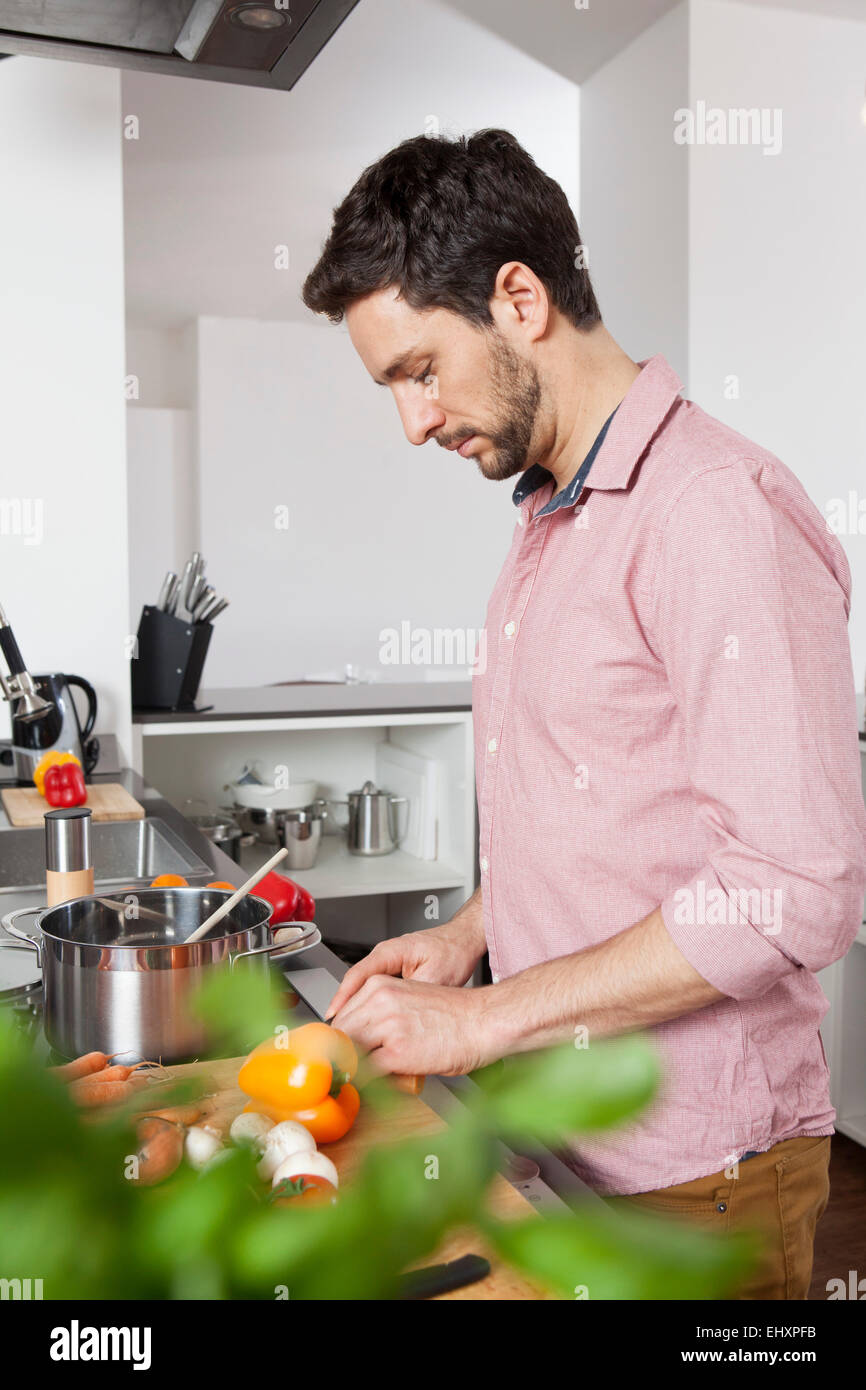 Man cooking in kitchen Stock Photo - Alamy