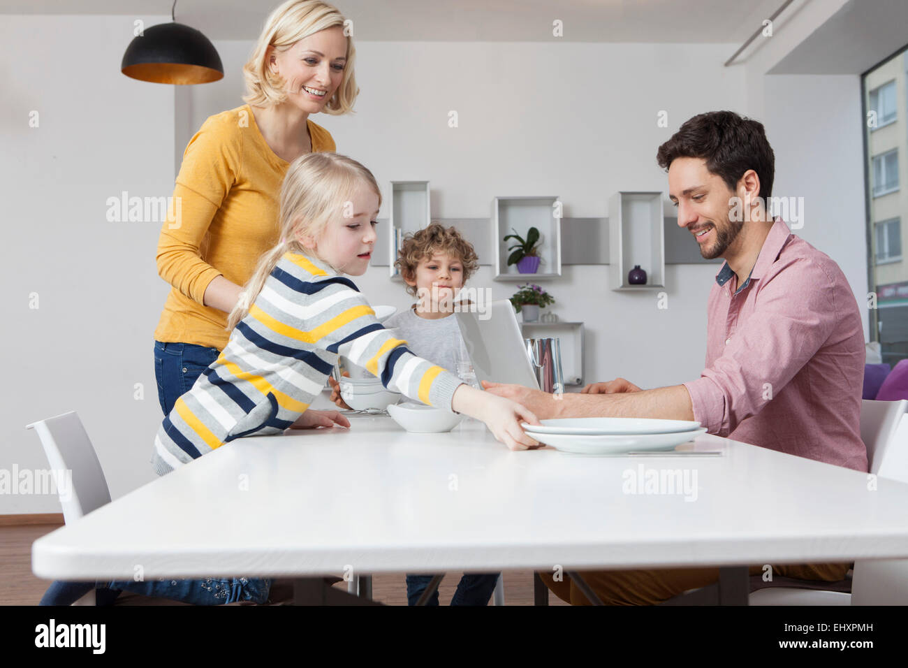 Girl laying table hi-res stock photography and images - Alamy