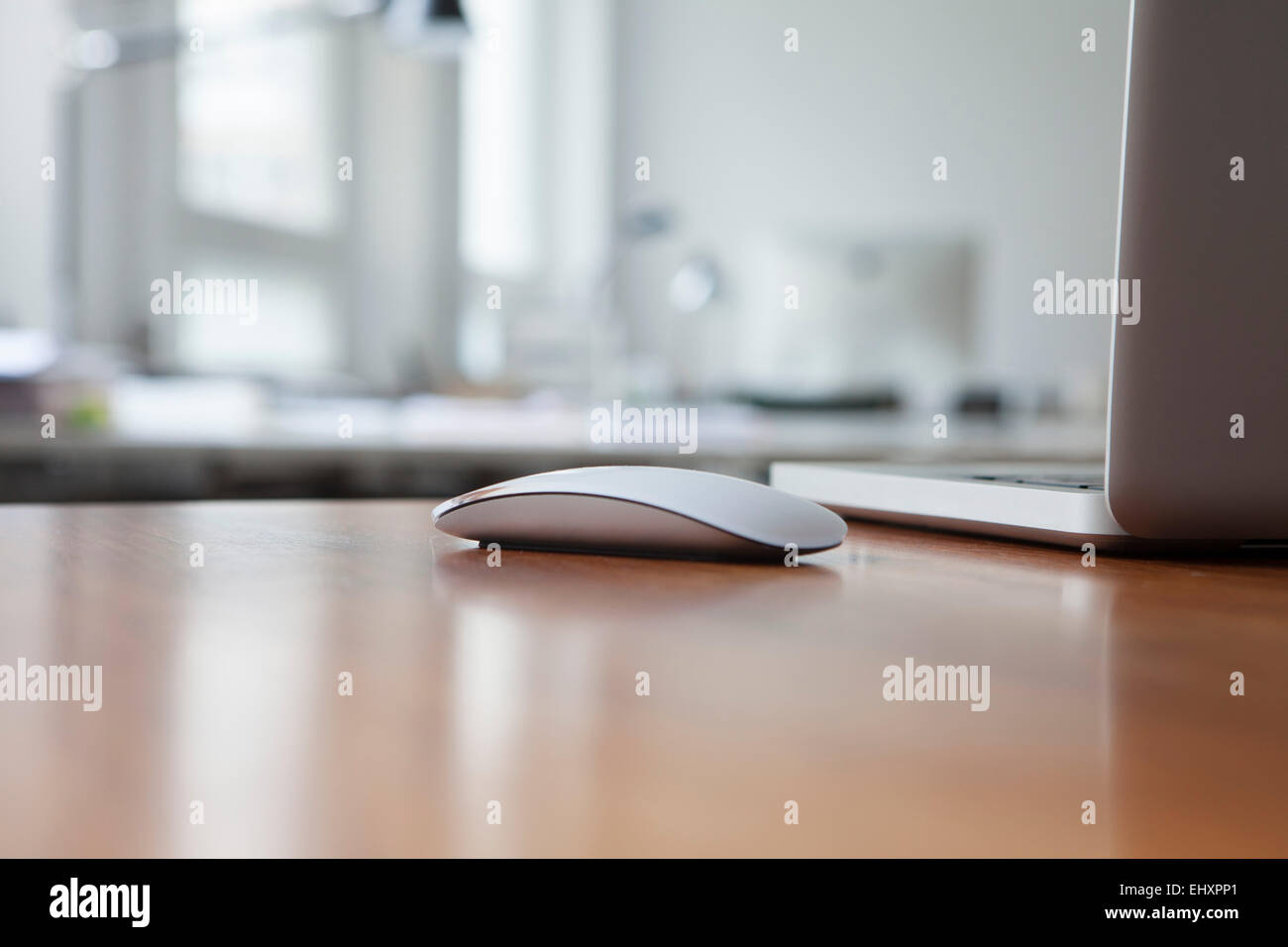 Mouse on wooden desk Stock Photo - Alamy