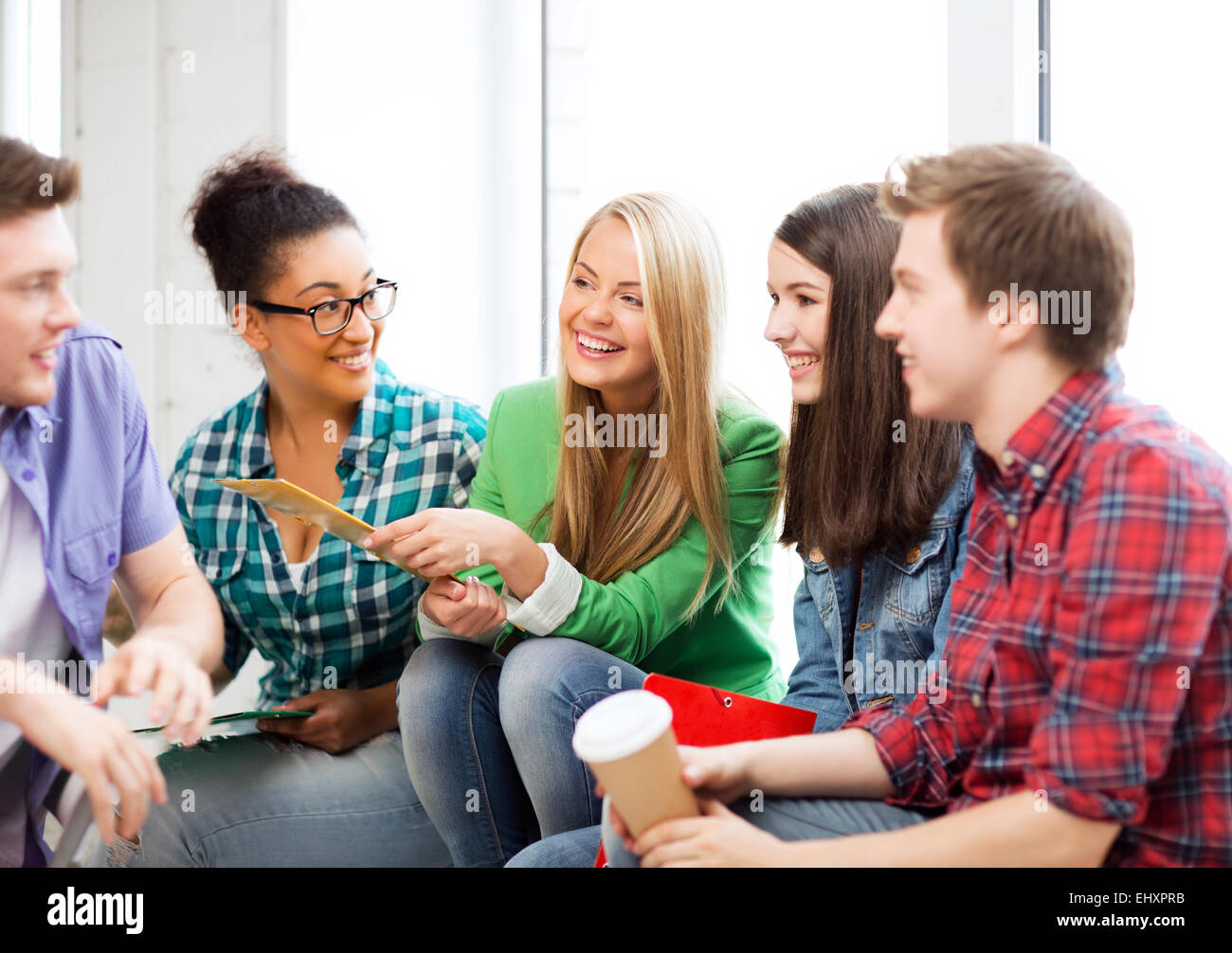 students communicating and laughing at school Stock Photo - Alamy