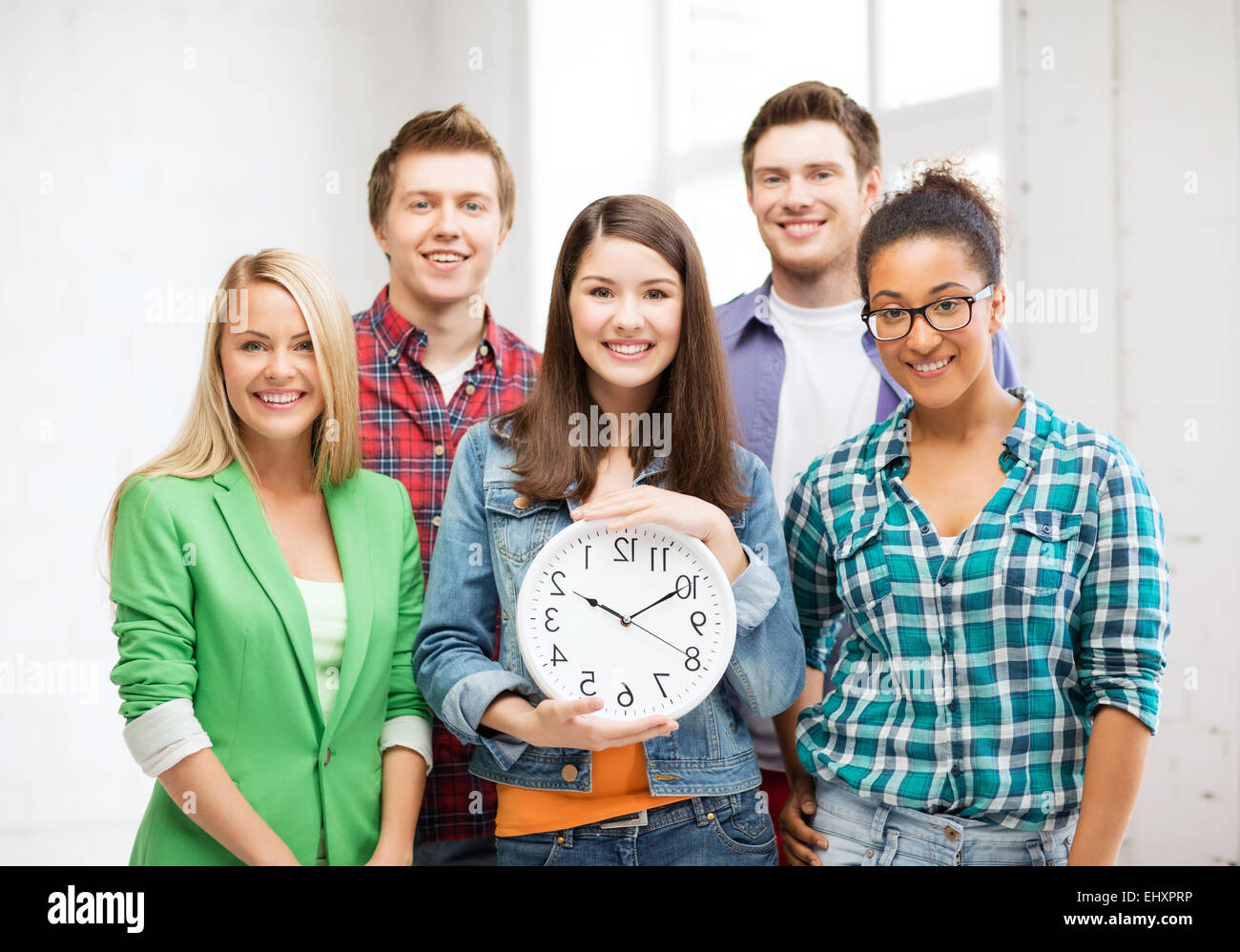 group of students at school with clock Stock Photo - Alamy