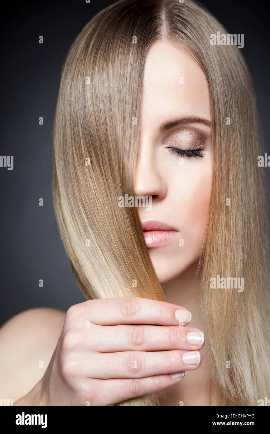 Beautiful young lady with straight hair Stock Photo - Alamy