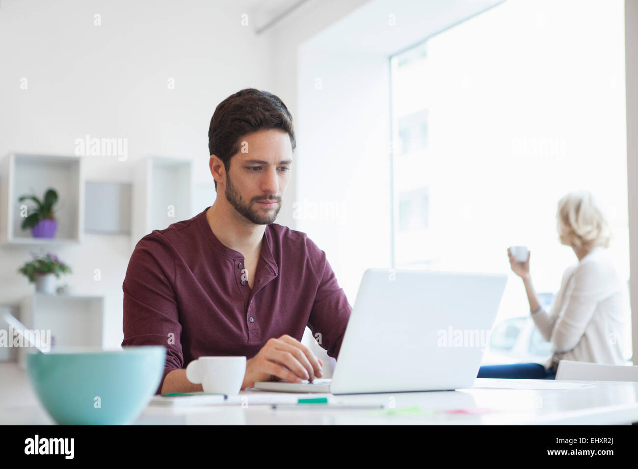 Man working with laptop at home office Stock Photo - Alamy