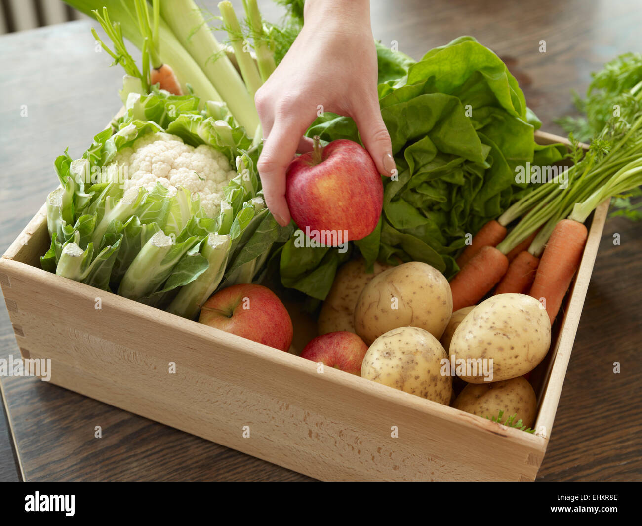 Hand taking crate with fresh fruit and vegetables Stock Photo - Alamy