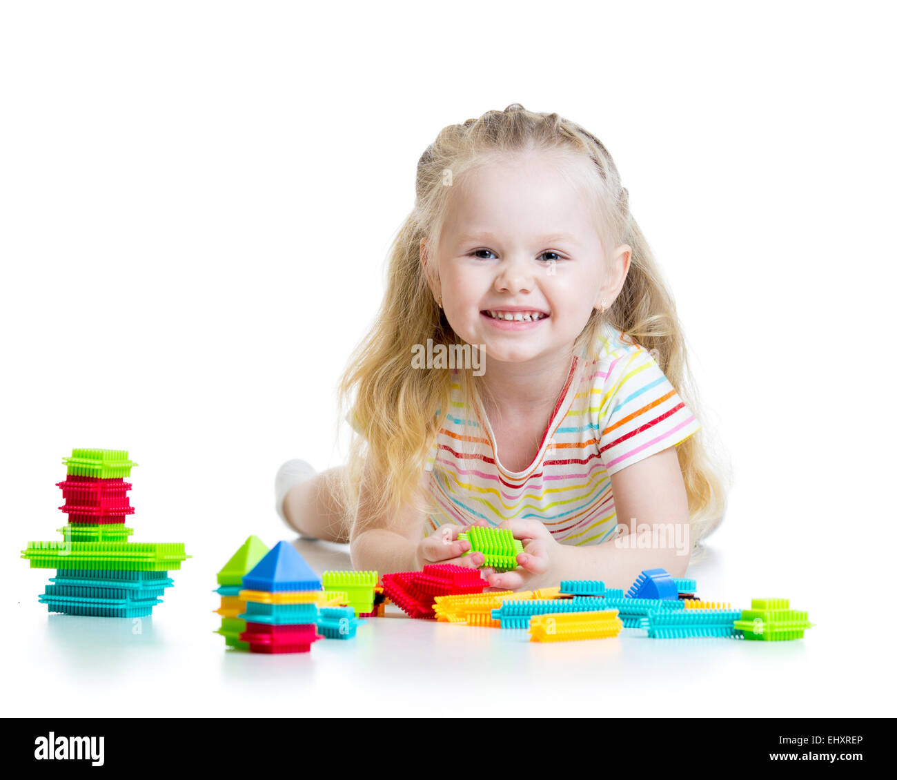 Portrait happy little girl playing building bricks Cut Out Stock Images ...