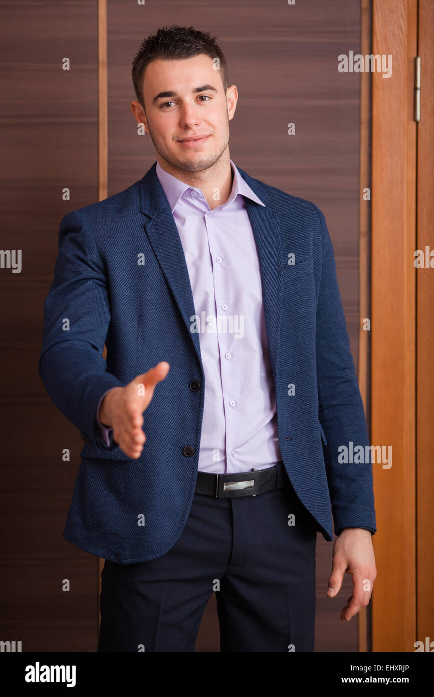 Man shows hand sign Stock Photo - Alamy