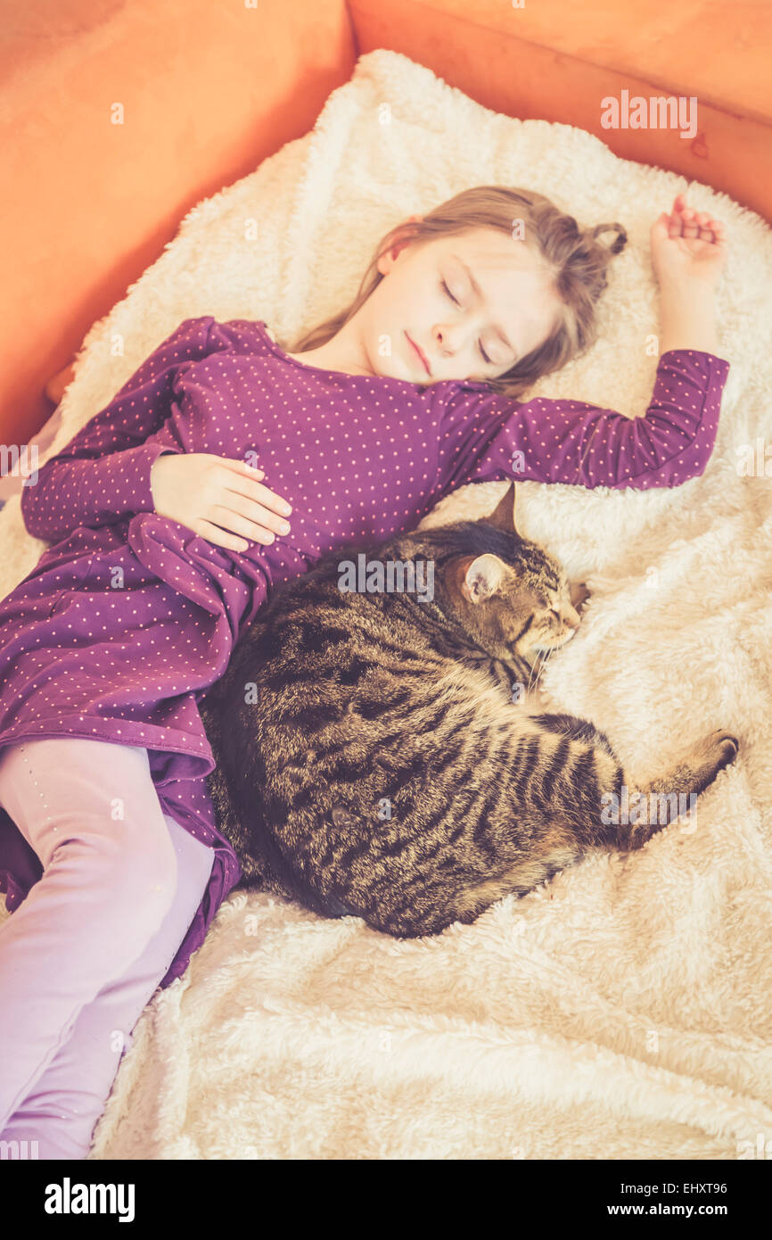 Child cat sleeping hi-res stock photography and images - Alamy