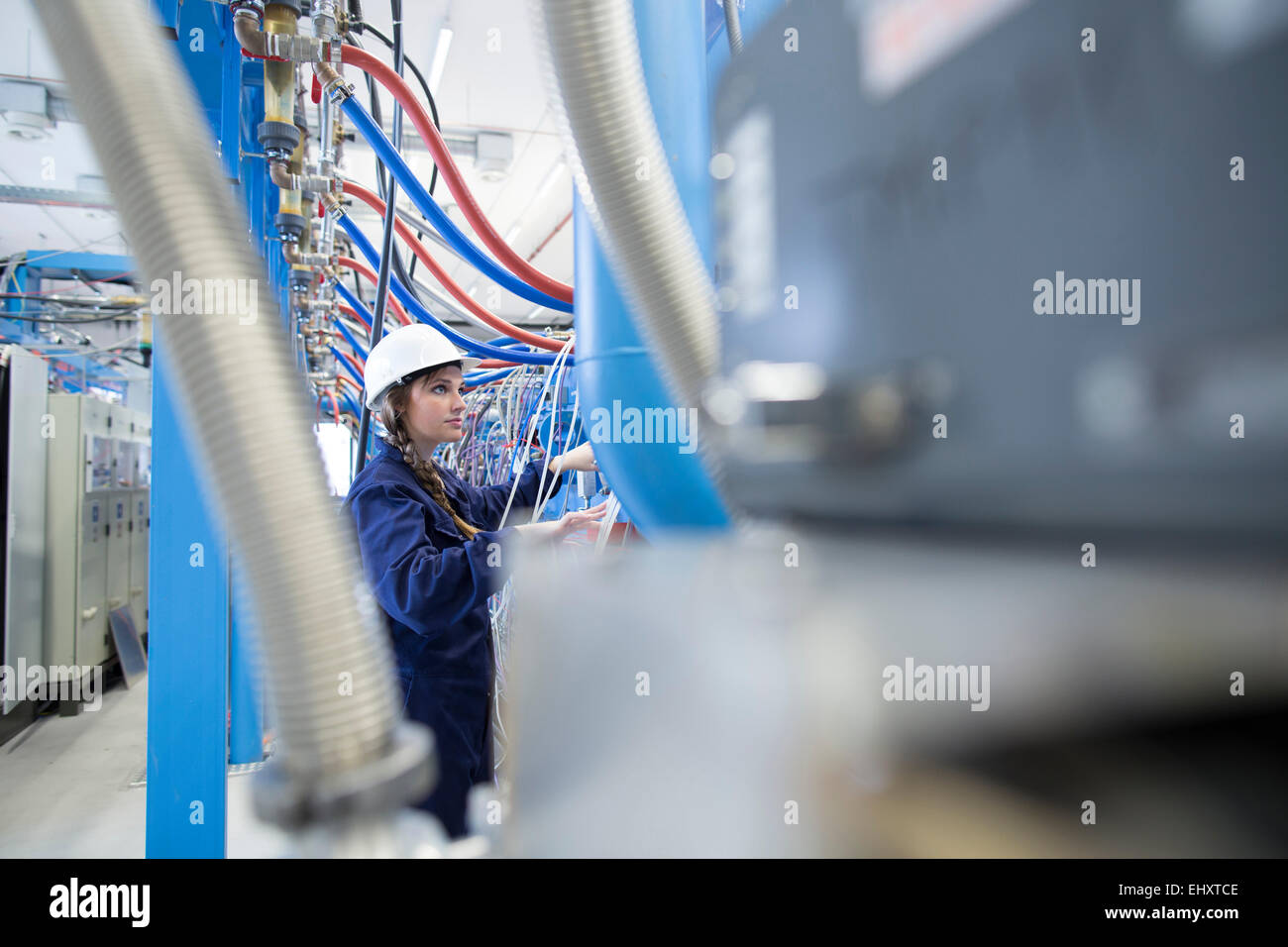 Technician in factory hall Stock Photo - Alamy