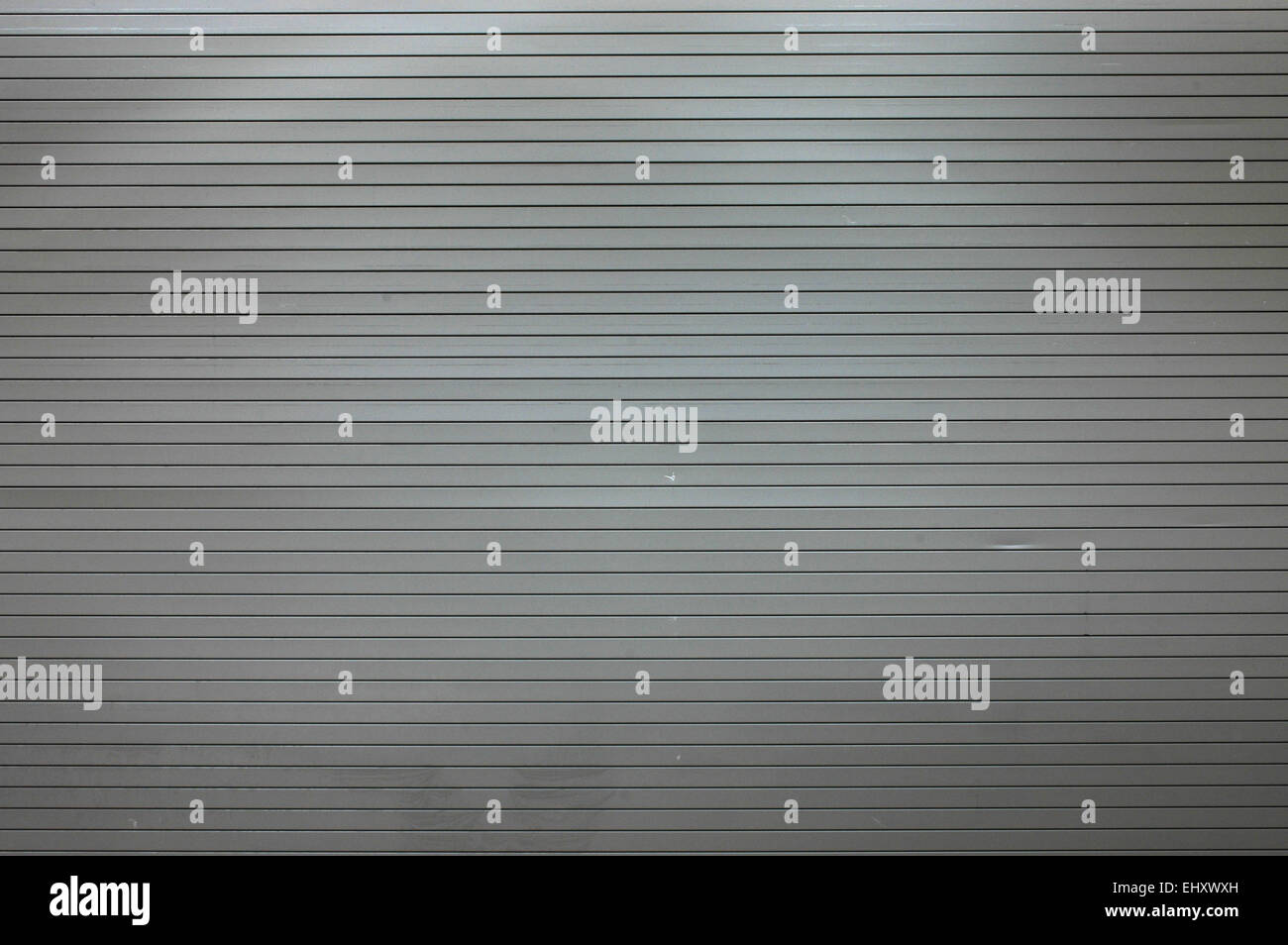 Abstract background texture of scuffed shop shutters Stock Photo - Alamy