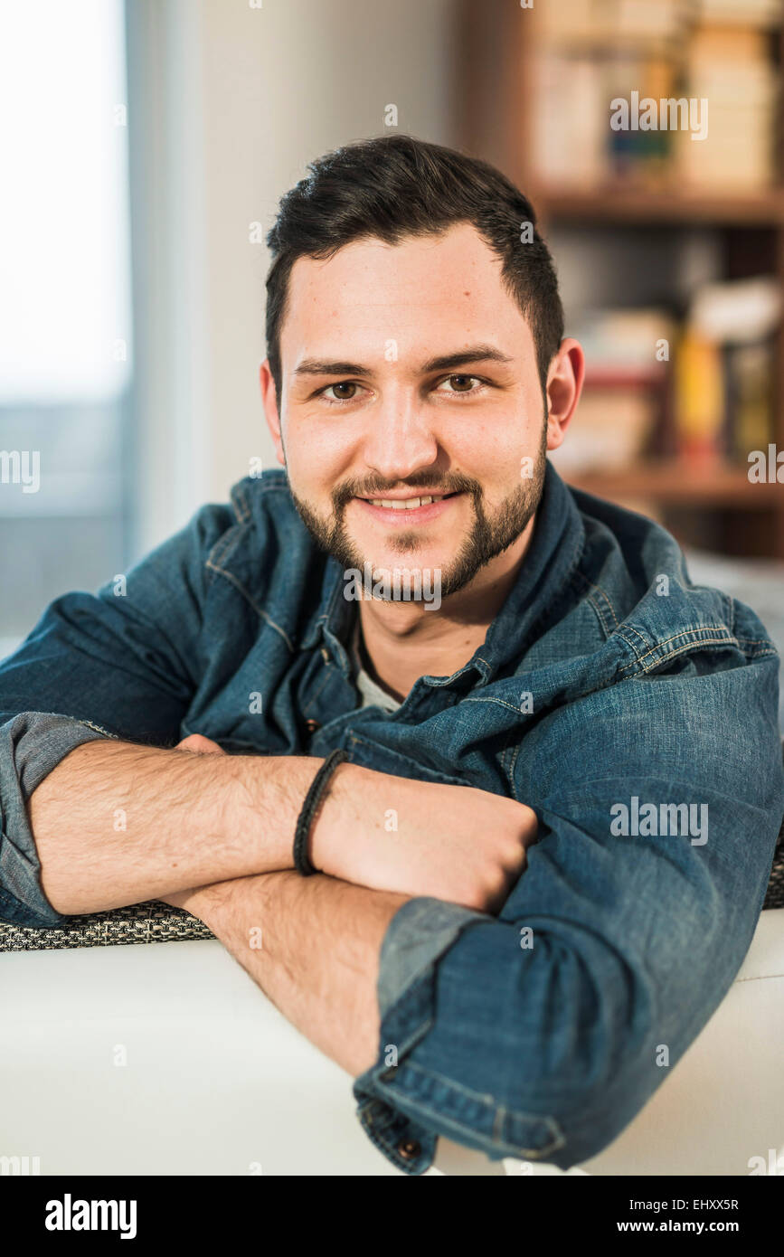 Portrait of smiling young man at home Stock Photo - Alamy