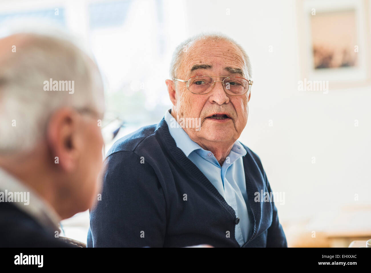 Two senior friends talking Stock Photo - Alamy