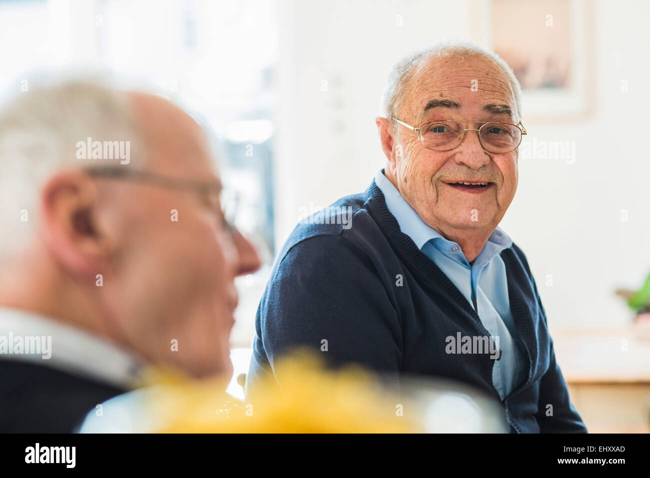Two senior friends talking Stock Photo - Alamy