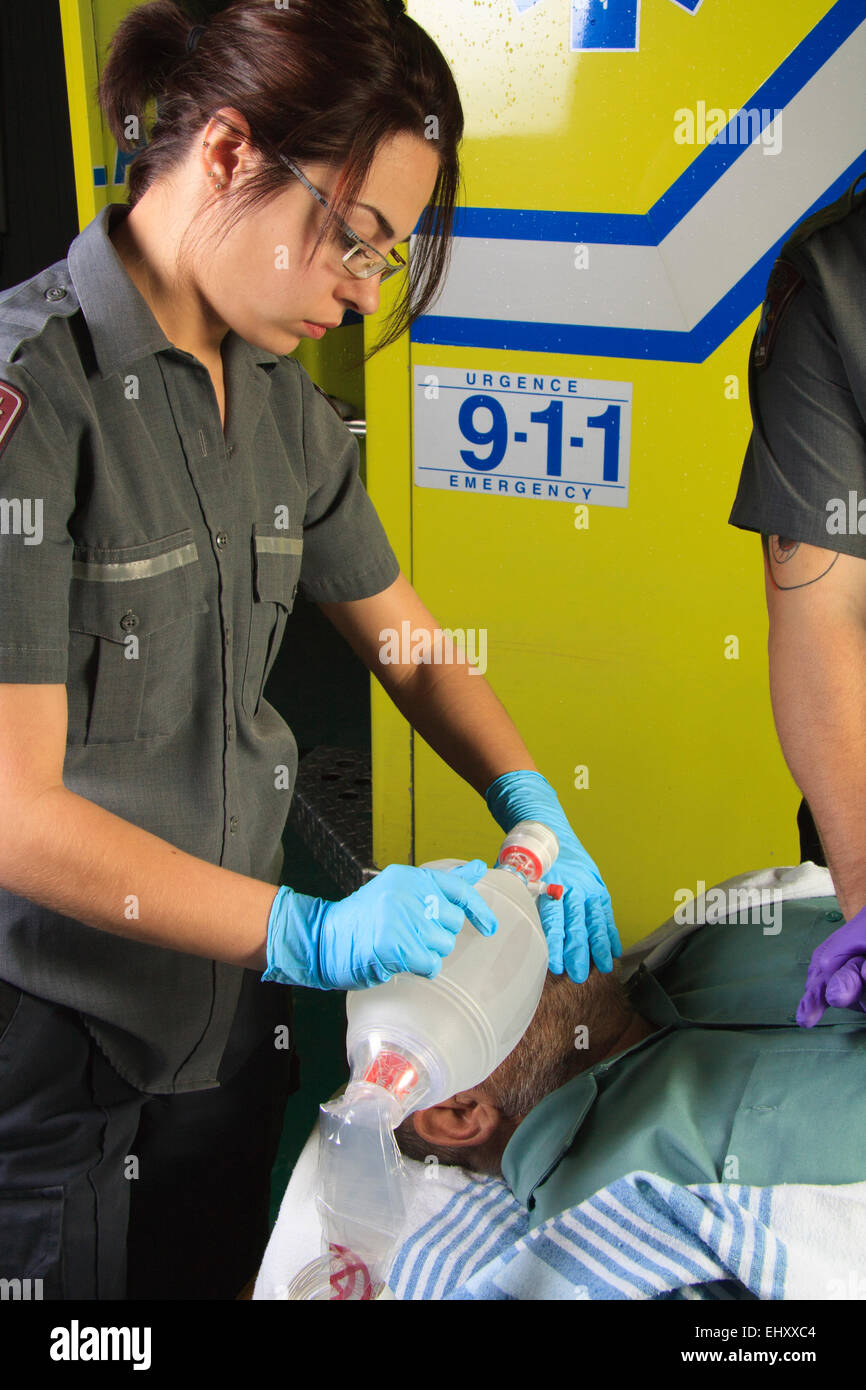 Paramedic who make a cardio-pulmonary resuscitation to a person Stock ...
