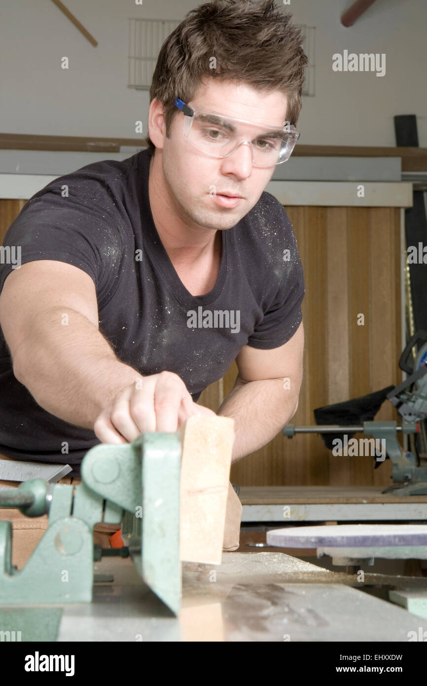 Carpenter at work on job using power tool Stock Photo - Alamy