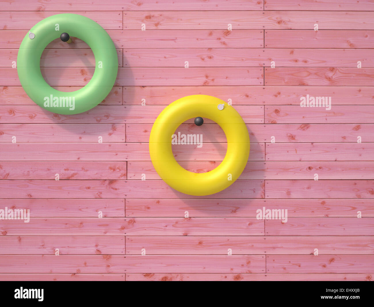 Two floating tires hanging on pink wooden wall Stock Photo - Alamy