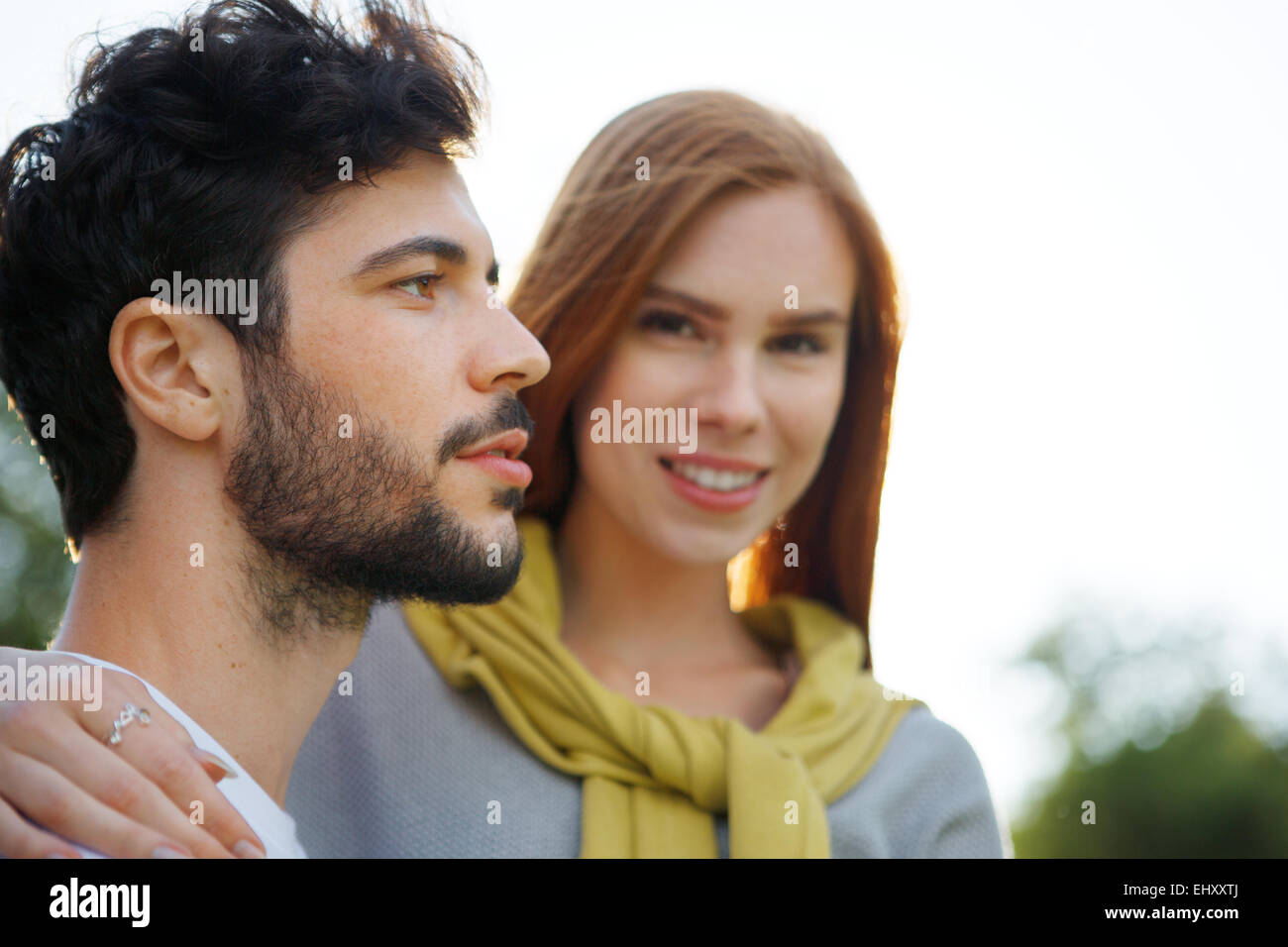 Young couple sharing an intimate moment outdoors Stock Photo - Alamy