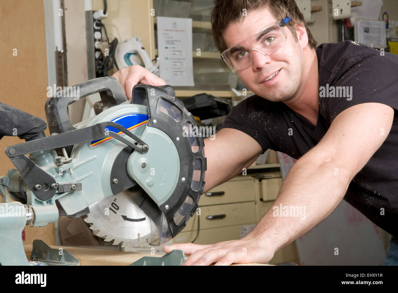Carpenter at work on job using power tool Stock Photo - Alamy