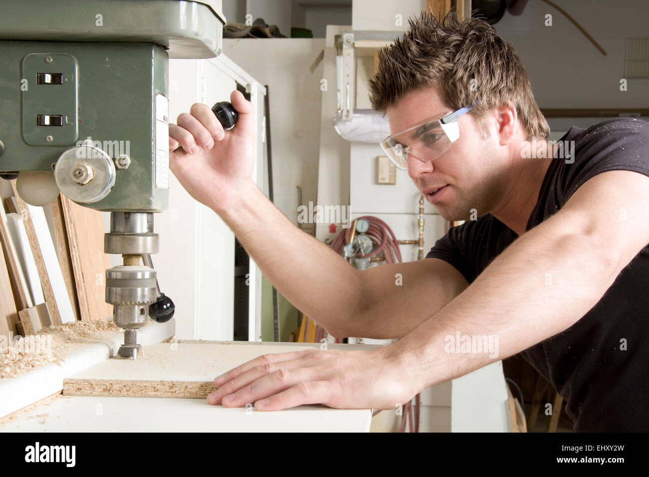 Carpenter at work on job using power tool Stock Photo - Alamy