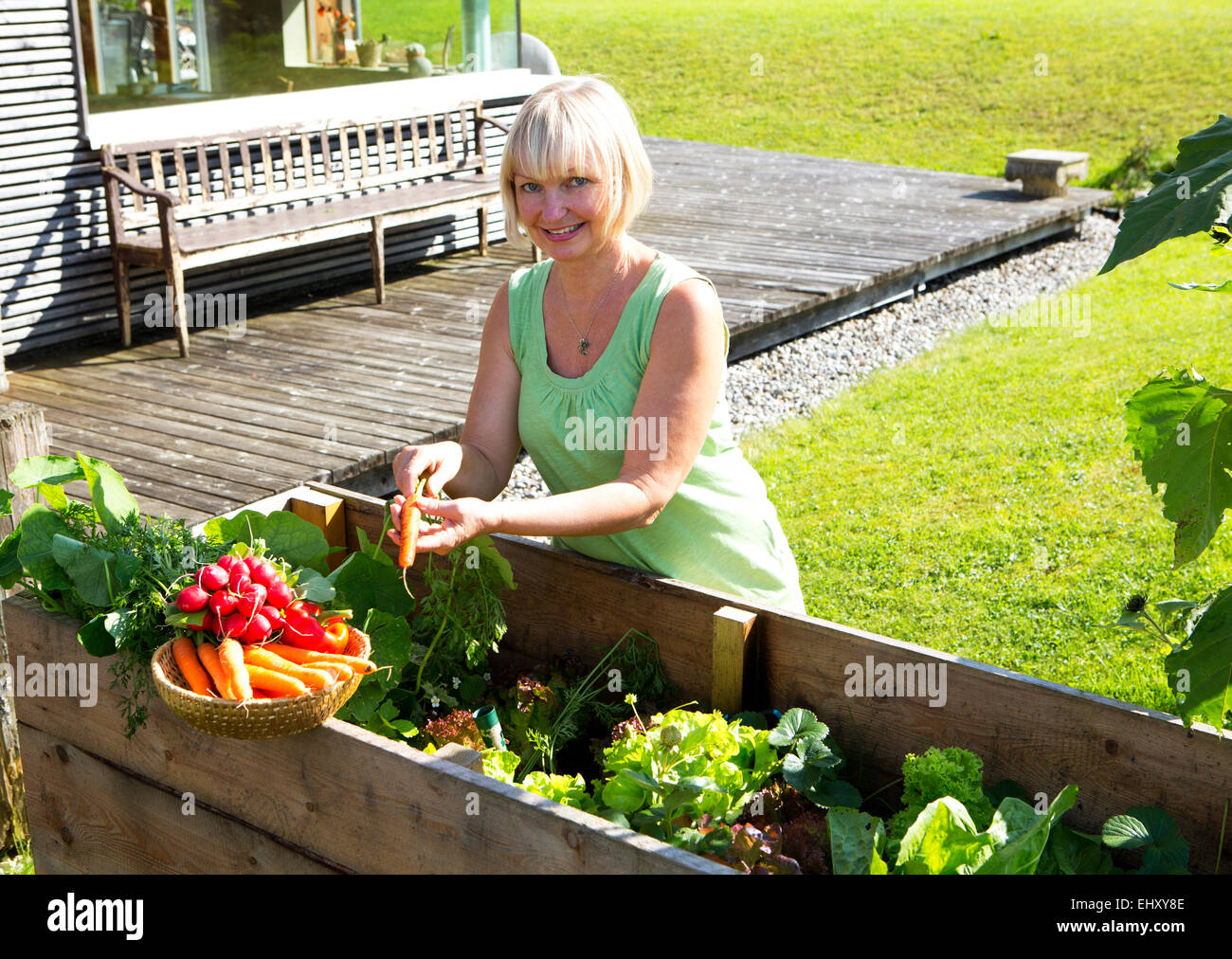 Portrait of woman gardening Stock Photo - Alamy