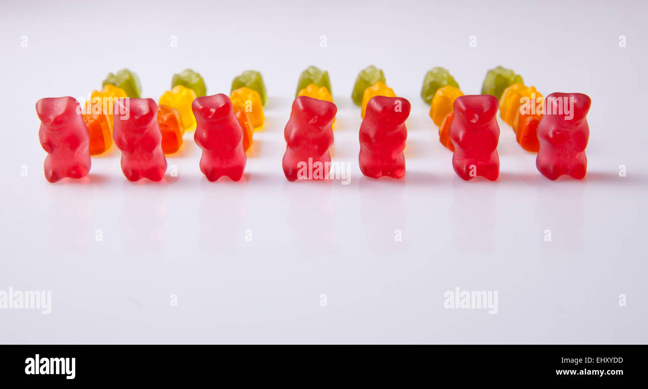 Rows of colorful gummy bears isolated over white background Stock Photo ...