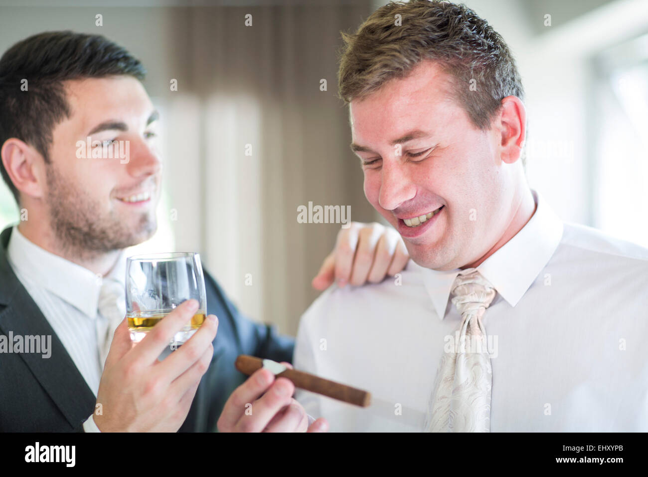 Well dressed man smoking a cigar or cigarette hi-res stock photography ...