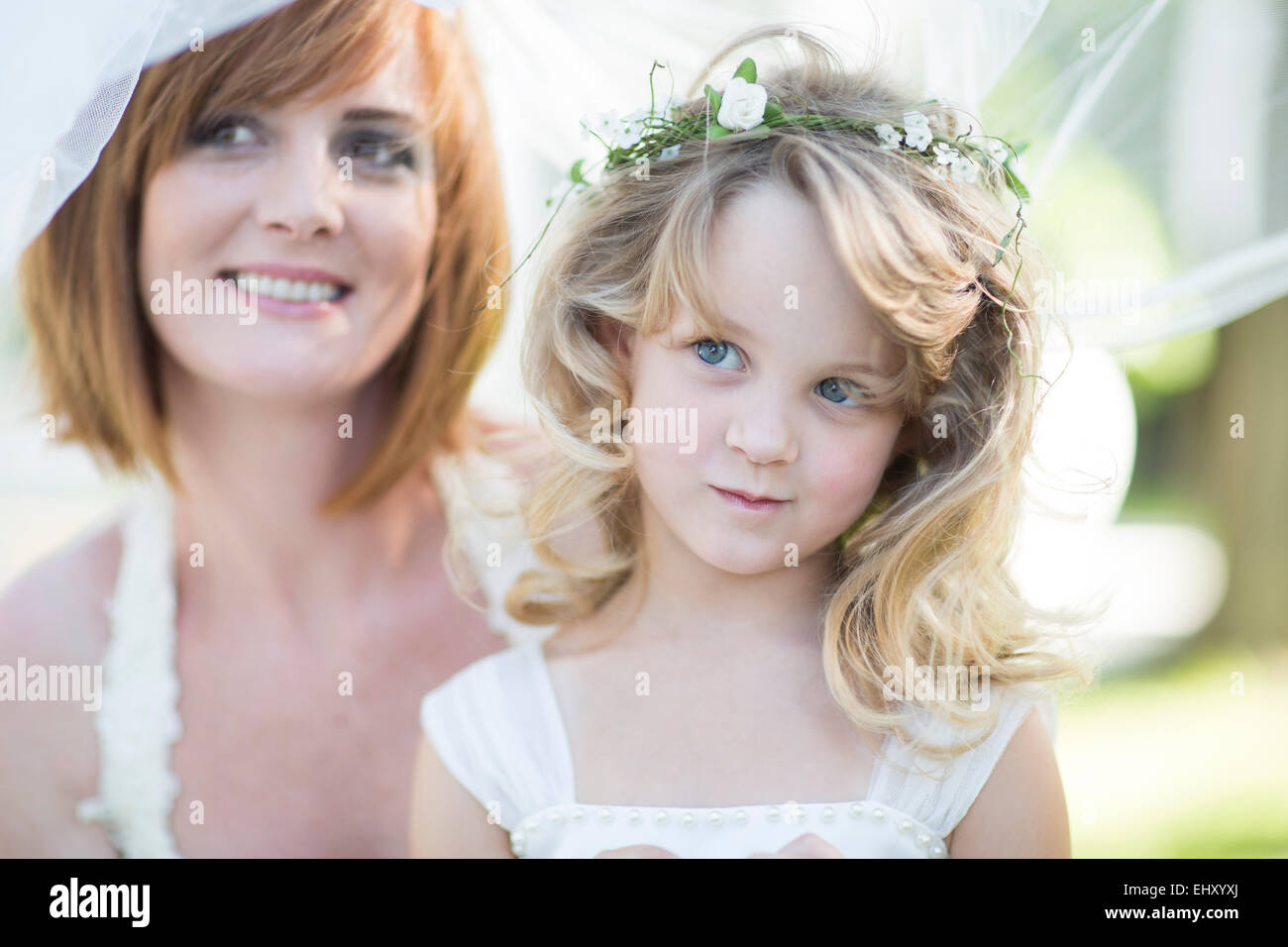 Bride and little bridesmaid at wedding Stock Photo - Alamy