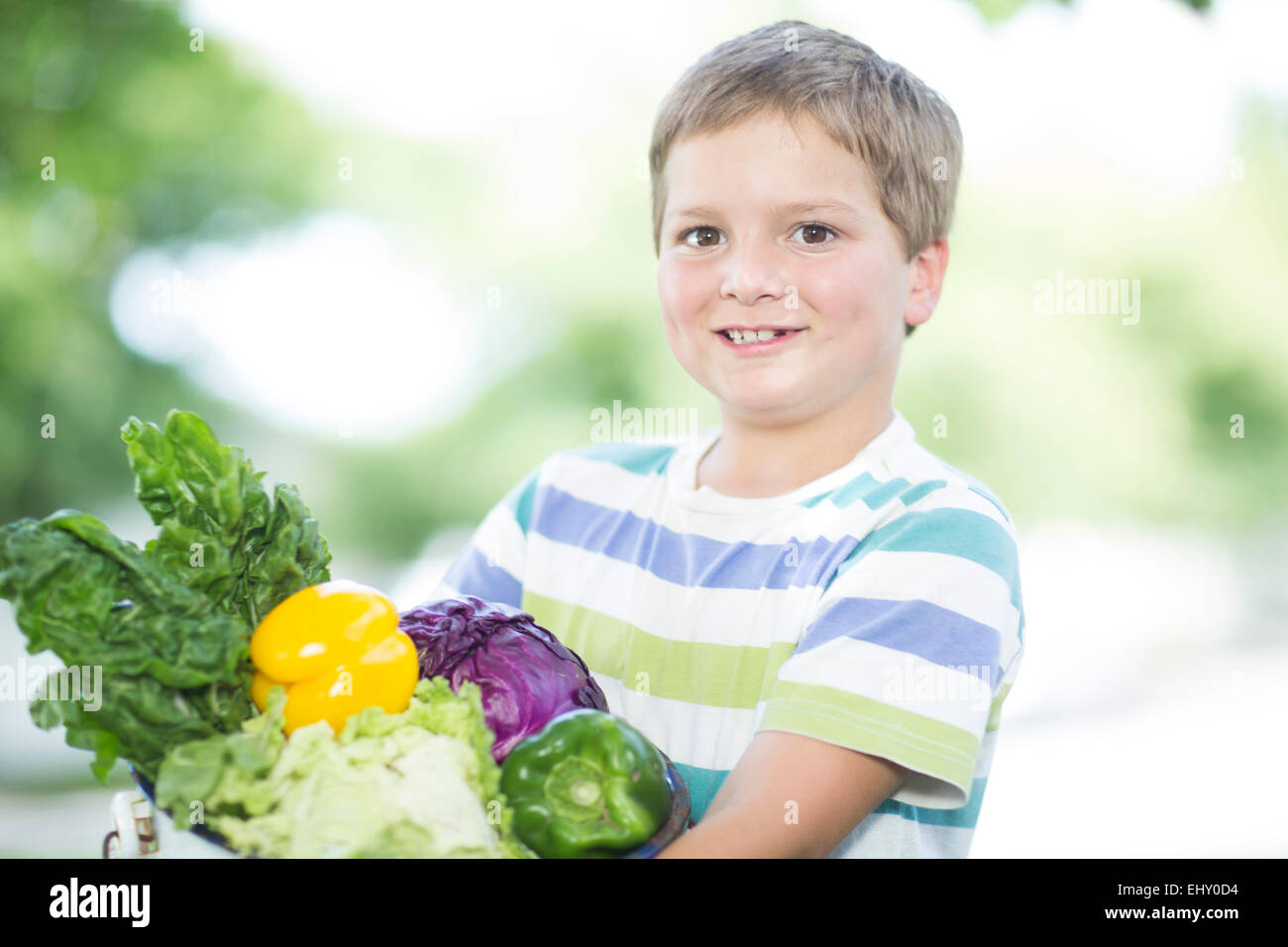 Portrait of a boy with bowl of mixed vegetables Stock Photo - Alamy