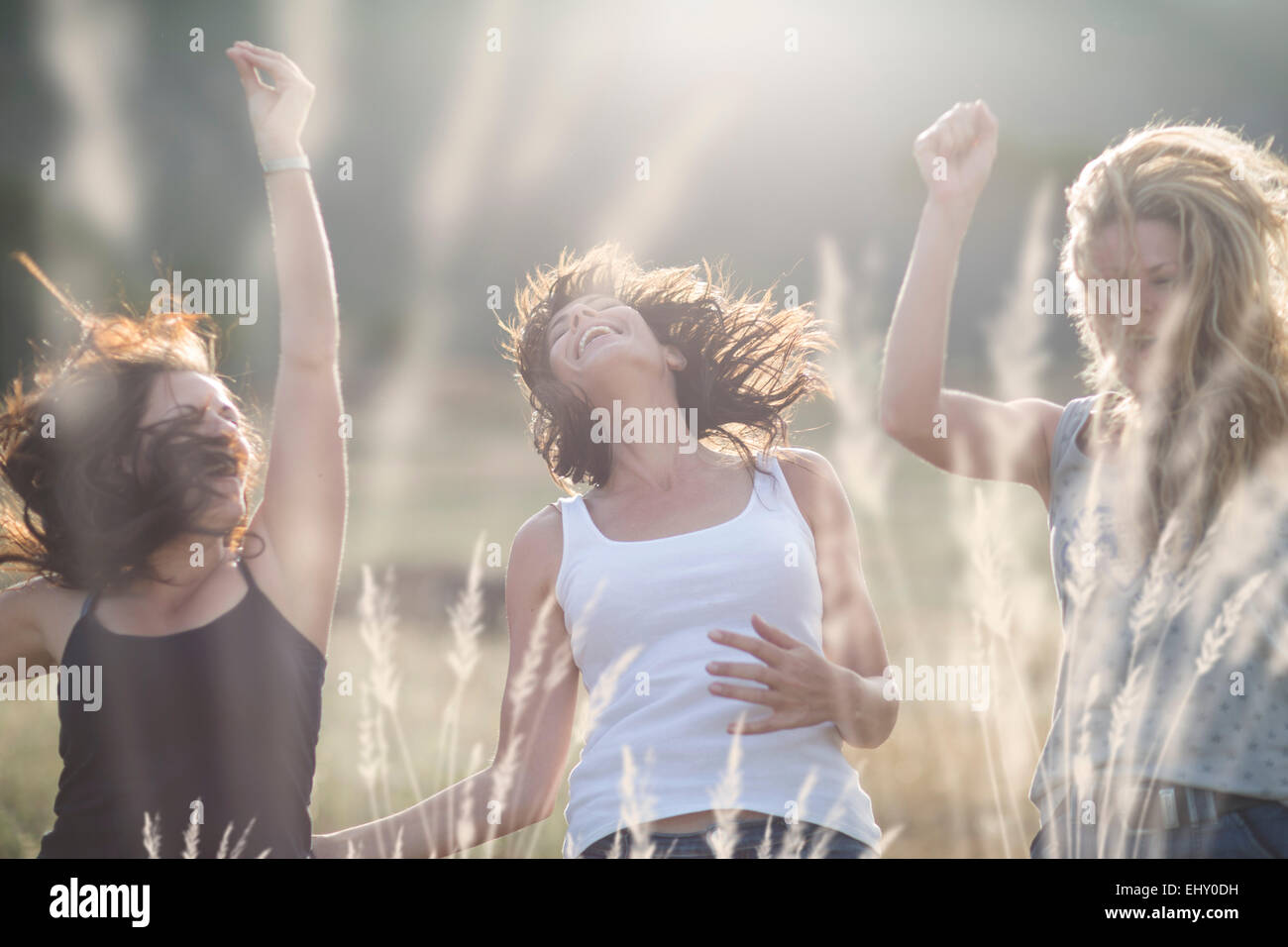 Cheerful dancing girl jumping hi-res stock photography and images - Alamy