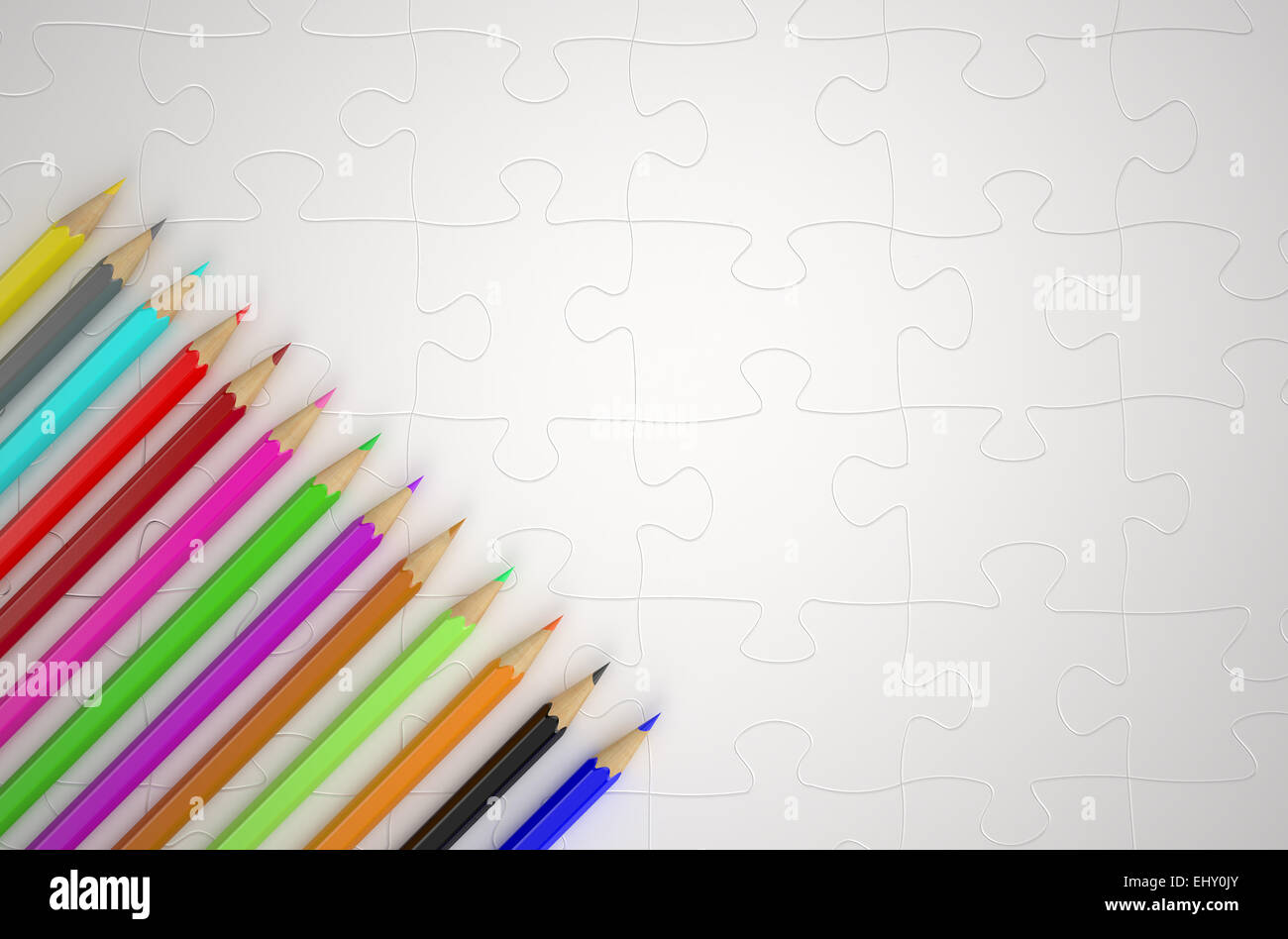 colored pencils on white puzzles Stock Photo - Alamy