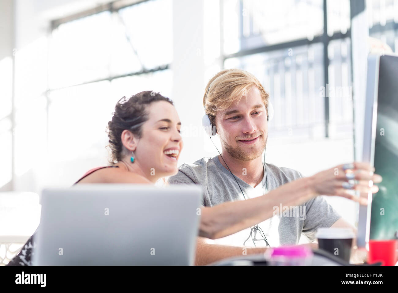 Creative office people having fun at desk Stock Photo - Alamy