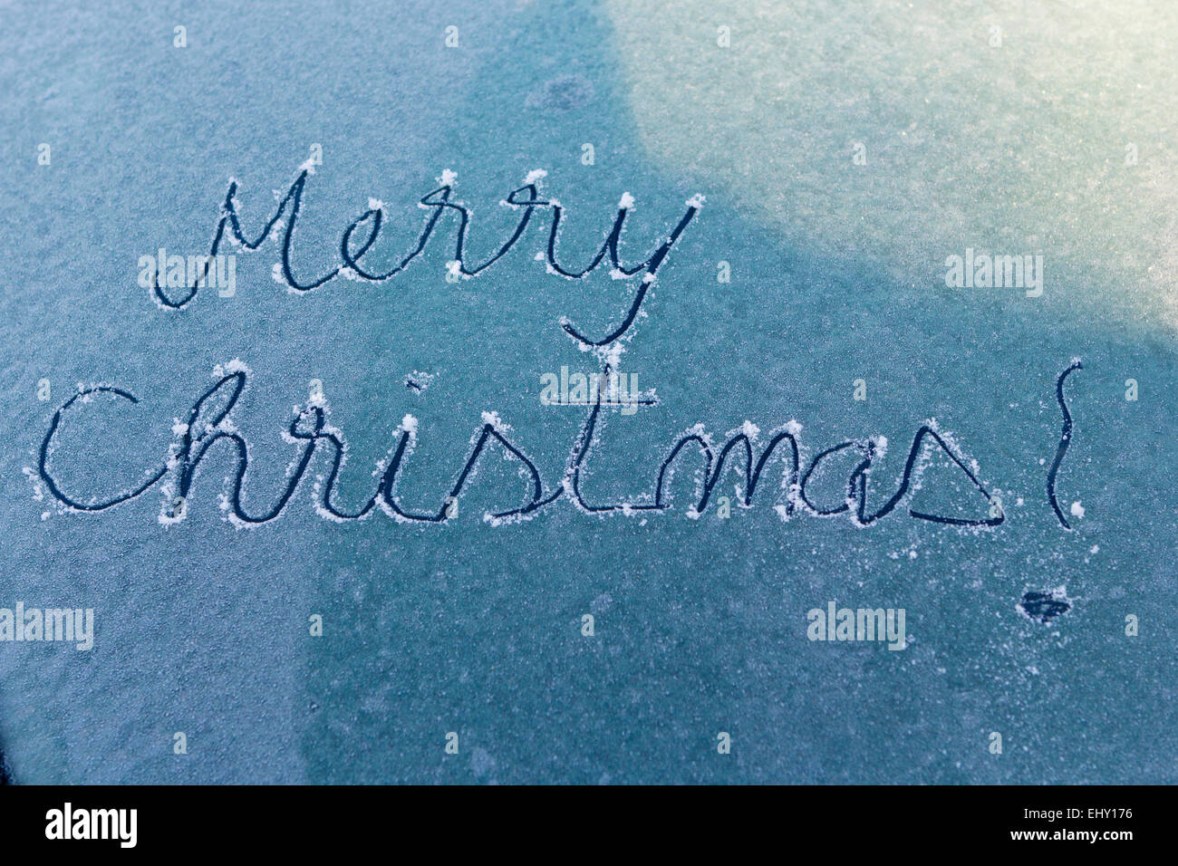 Merry Christmas in ice on back window of car Stock Photo - Alamy