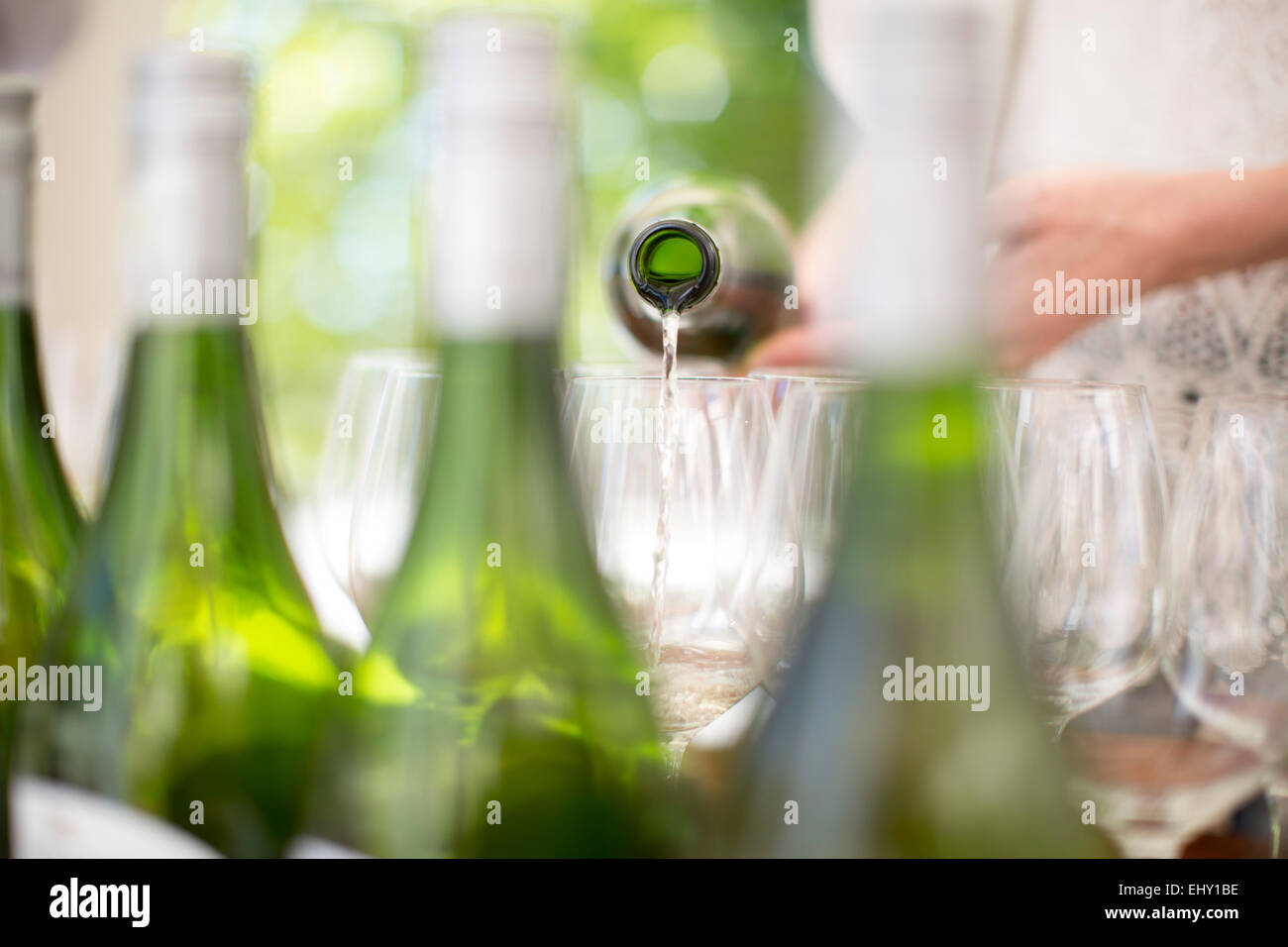 White wine being poured at wine tasting session Stock Photo - Alamy