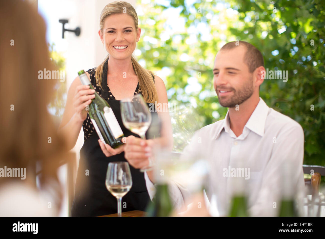 Waiter Presenting Wine Bottle High Resolution Stock Photography and ...