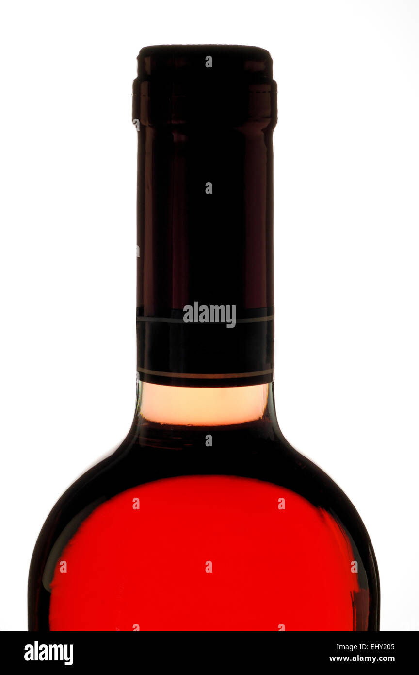 Red wine bottle closeup backlit with black capsule Stock Photo - Alamy