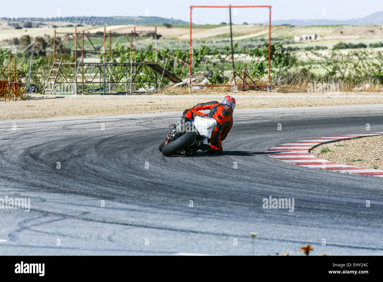 Curve fast right. Particular of a biker in Running Track Stock Photo ...