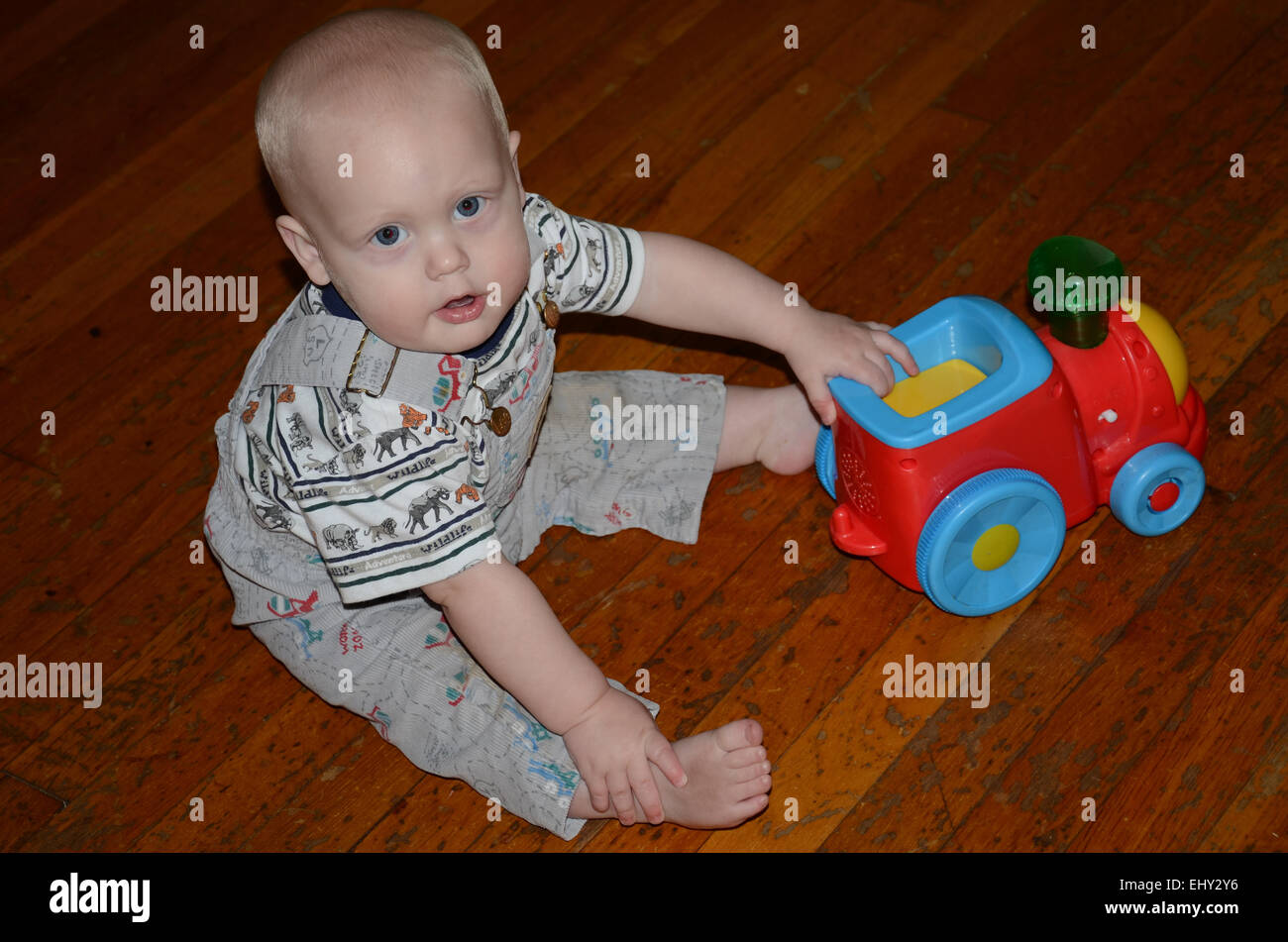 A baby with his toy train Stock Photo - Alamy