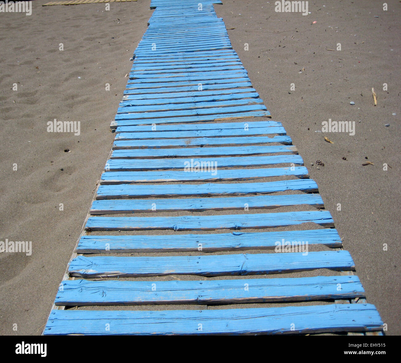 A blue wooden alley on a sandy beach Stock Photo - Alamy