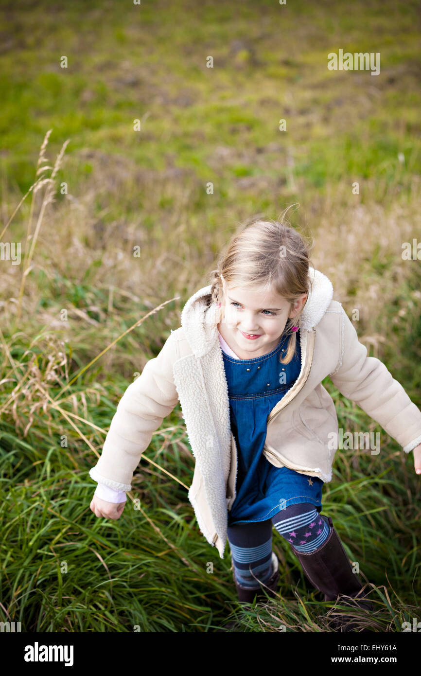 Girl in field Stock Photo - Alamy