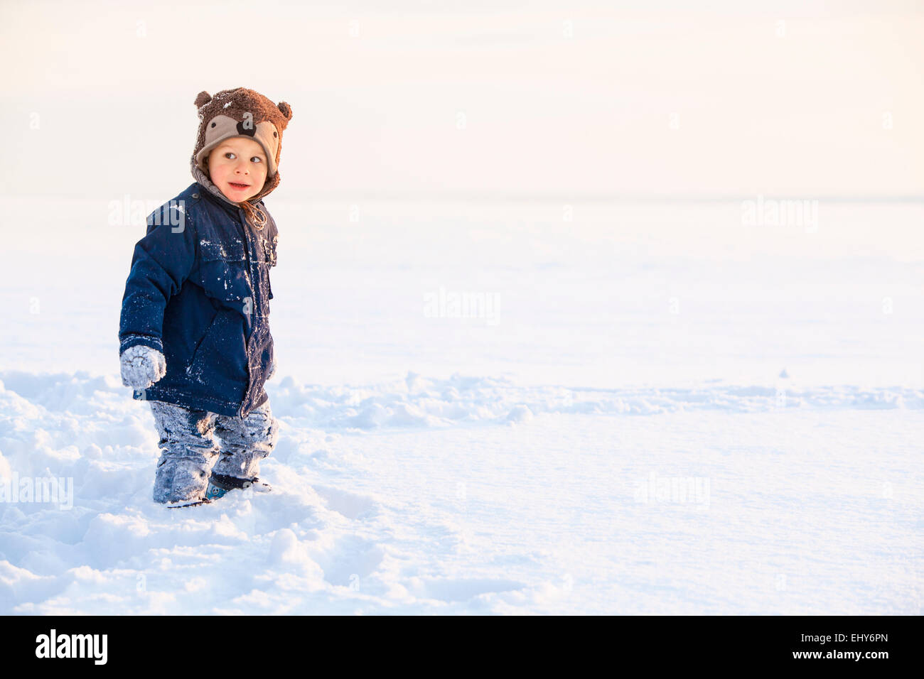 Little boy in snowy landscape Stock Photo - Alamy