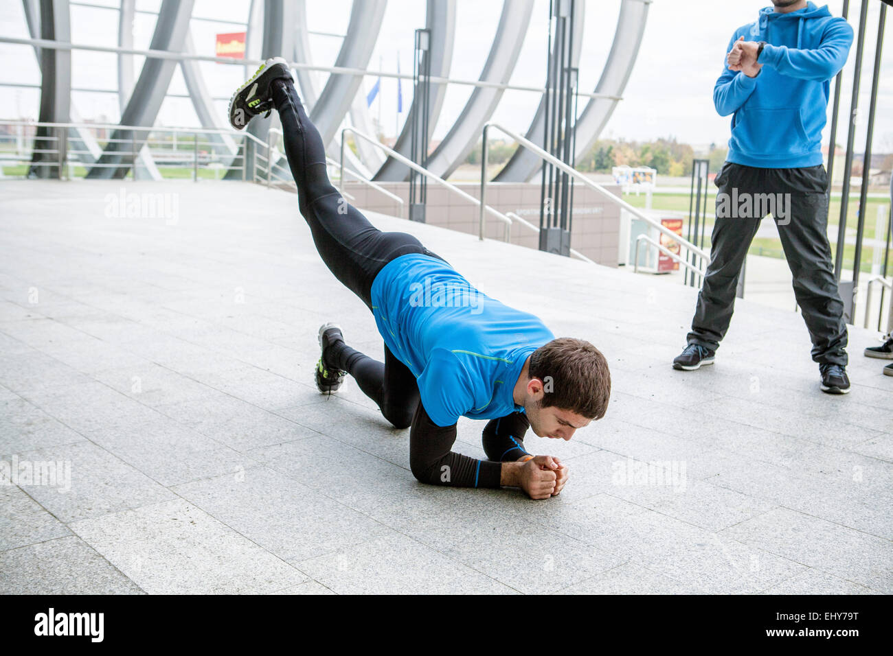 Male runner stretching leg Stock Photo - Alamy