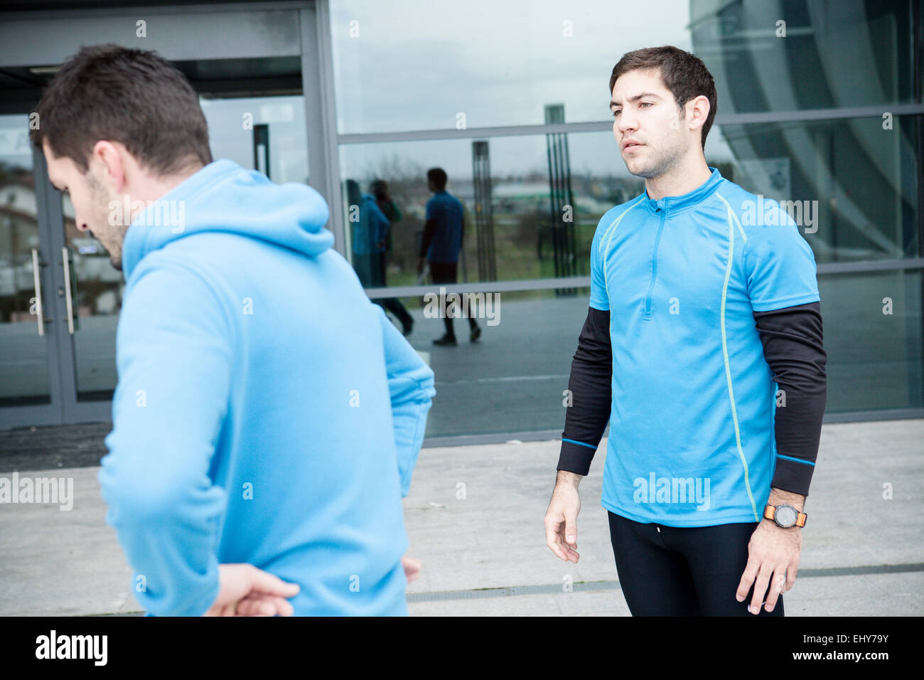 Male runners taking a break Stock Photo - Alamy