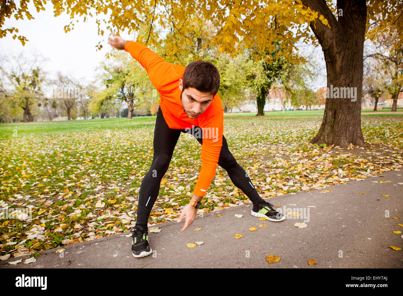 Male runner stretching hi-res stock photography and images - Alamy