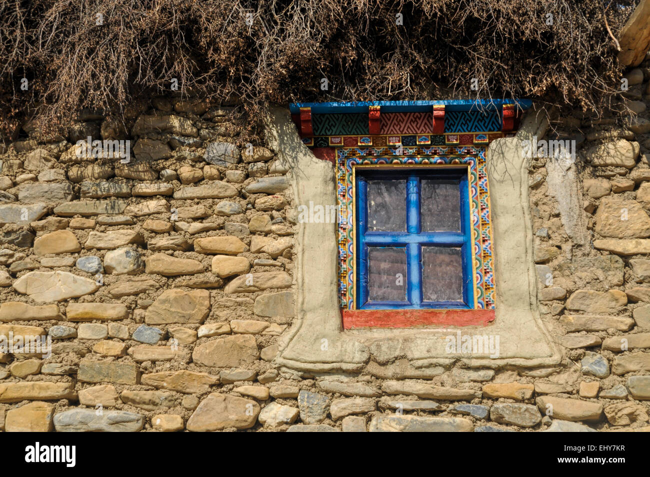 Traditional decorated window on old stone nepalese house Stock Photo ...