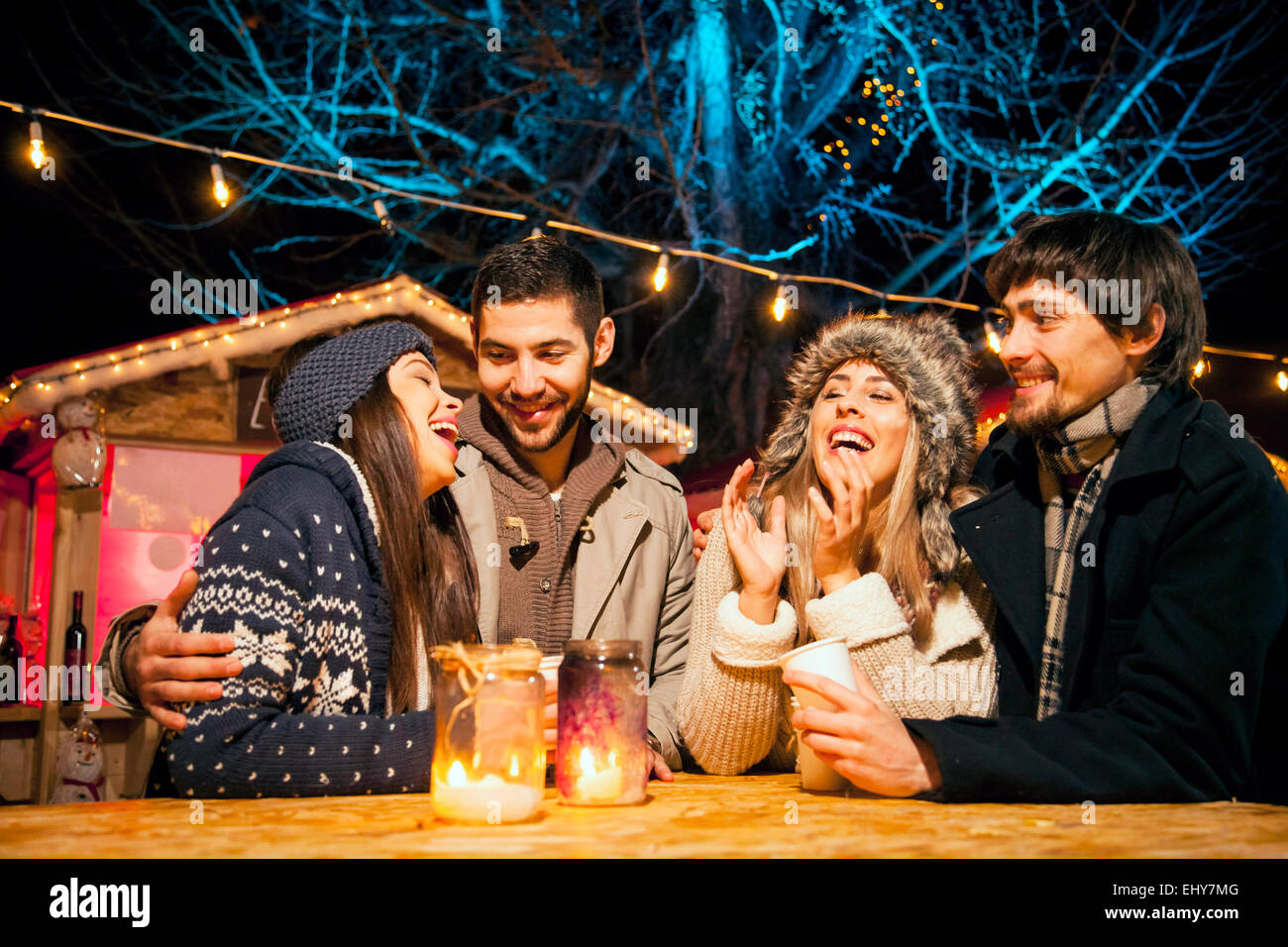 Group of friends having fun at Christmas Market Stock Photo - Alamy