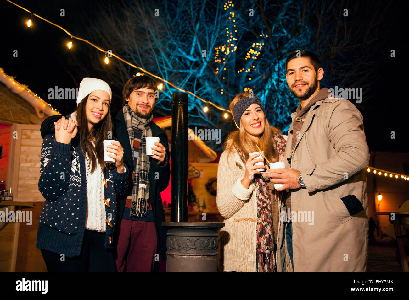 Group of friends having fun at Christmas Market Stock Photo - Alamy