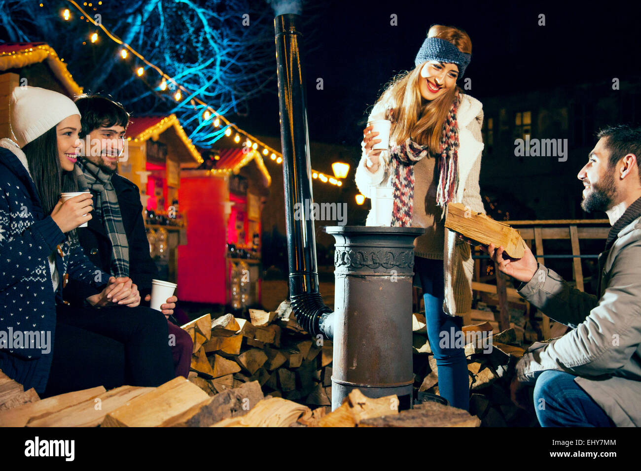Group of friends having fun at Christmas Market Stock Photo - Alamy